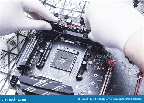 Hands Of A Technician Assembling Computer Hardware Parts New Cpu Is