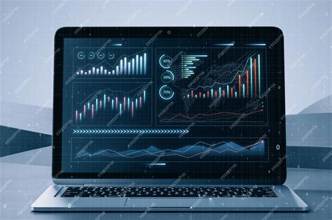Premium Photo Close Up Of Laptop On Desktop With Abstract Glowing Candlestick Business Chart