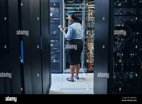 Woman Server Room And Engineer With A Tablet For Programming System Upgrade Or Cable