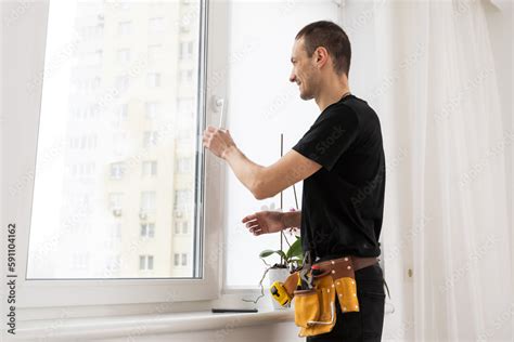 Handsome Babe Man Installing Bay Window In A New House Construction Site Stock Photo Adobe Stock