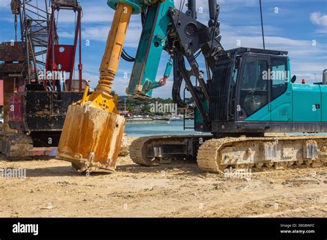 An Excavator With A Drilling Bucket Drill Bit With Hard Alloy Incisors Teeth That Can