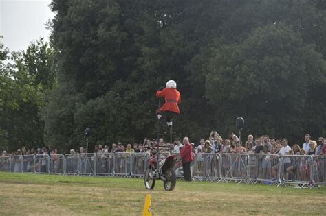 Premium Photo People Looking At Man Performing Stunts On Motorcycle