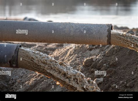 Industrial Effluent Pipeline Discharging Liquid Industrial Waste Into A River Stock Photo Alamy