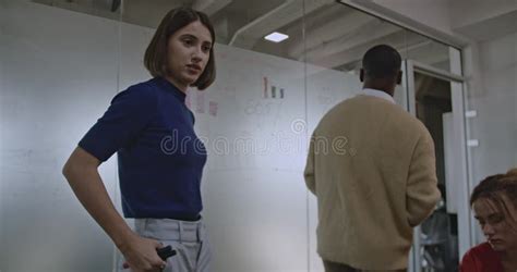 Diverse Business Team Collaborates On Project Strategy In Modern Office Analyzing Data On