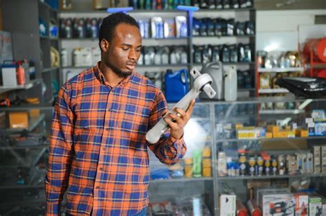 Premium Photo Young African American Man In Auto Parts Store