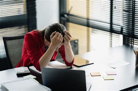 Frustrated Businesswoman Holding Her Head Tired From Work Having