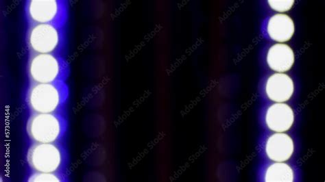 Vertically Falling Blur Light Circles White Bokeh With A Blue Outline And Reflexes Fall Down On