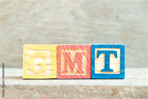 color alphabet letter block in word gmt abbreviation of greenwich mean time on wood background