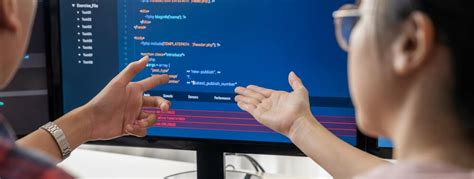Premium Photo Female Programer Explain While Pointing Code Displayed On Computer Burgeoning