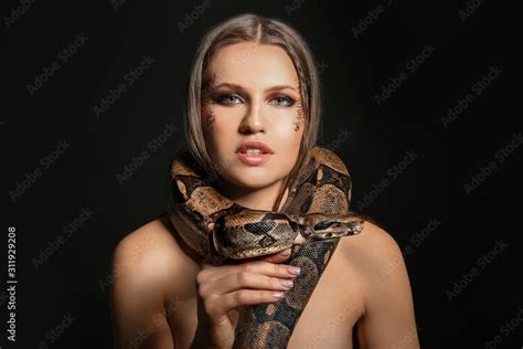 Beautiful Woman With Boa Constrictor On Black Background Stock Photo Adobe Stock