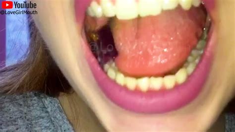 Girl With Beautiful Teeth Chews And Bites A Gummy Bear To Pulp Loud