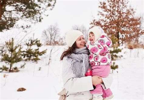 Free Photo Happy Mother And Baby Are Smiling And Hugging