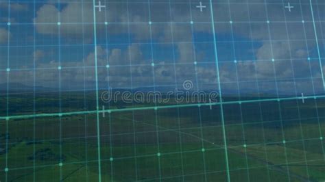 Grid Overlay Animation Over Scenic Landscape With Clouds And Fields