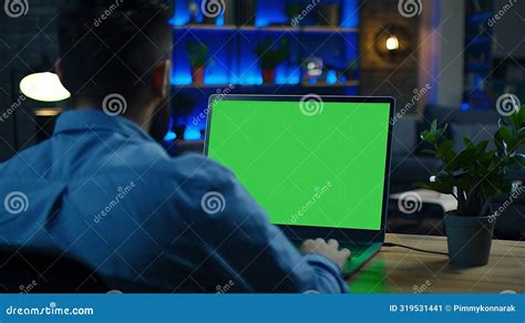 Generative Ai Male Employee Looks At Greenscreen On Laptop Display Checking Isolated Chromakey