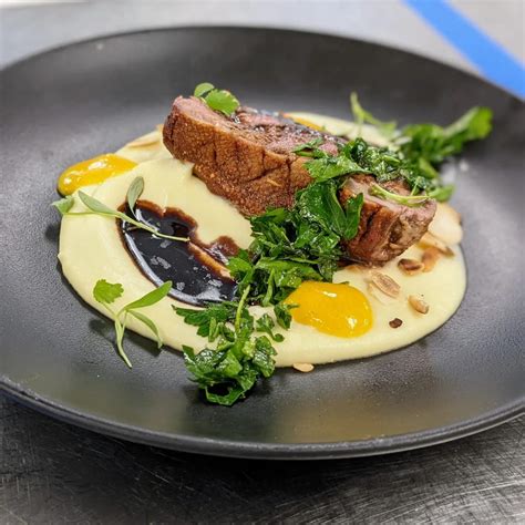 Seared Duck Breast With Parsnip Puree Kumquat Jam Orange Balsamic Gastrique Herb Salad And