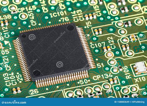 Close Up Of Integrated Semiconductor Microchip On Circuit Board Stock