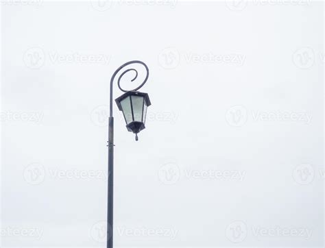 A Beautiful Street Lamp On A Background Of A Gray Sky Patterned Lamp Shade 12195416 Stock