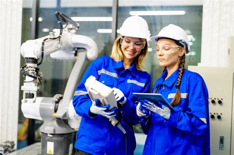 Engineer Inspecting Automatic Ai Robot Arm And Machines In Factory Engineer Inspecting