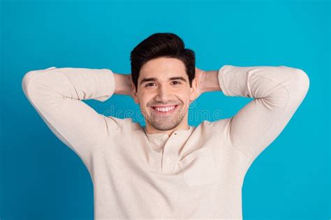 Portrait Of Nice Young Man Arms Behind Head Beaming Smile Wear Pajama Isolated On Blue Color