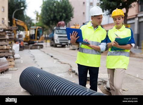 Male And Female Engineers In Construction Area Stock Photo Alamy