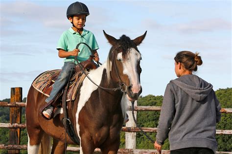 Download Cute Young Equestrian Horseback Riding Wallpaper