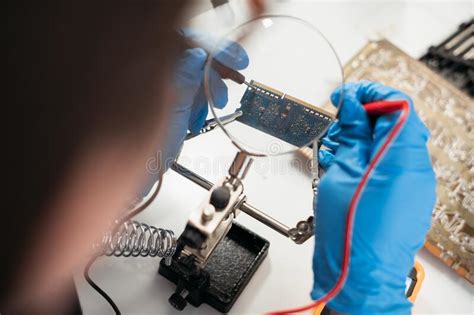 Service Engineer Testing New Ram Memory Chip To The Laptop With Digital Multimeter Repairing