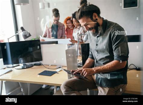 Happy Software Developers Working On Meeting Programming Advanced Code