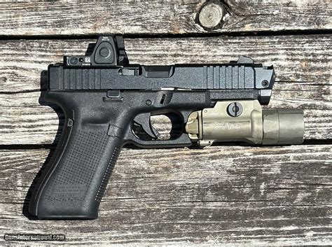 Used Glock 45 9mm W Trijicon Rmr And Radian Afterburner Ramjet