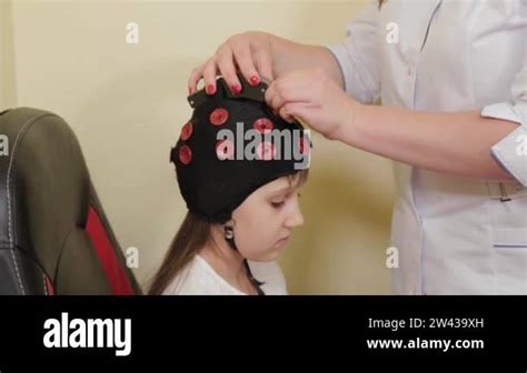 Preparing For An EEG Analysis Of The Brain In The Doctors Office Installation Of A Device For