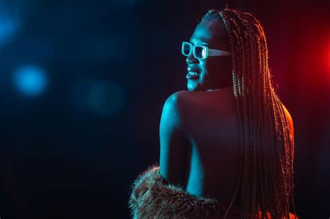 Premium Photo Black Ethnic Woman With Braids With Blue And Red Led Lights Model From The Back