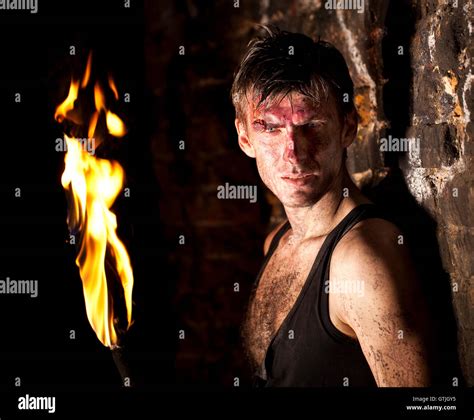 Mysterious Man With Torch In Hand Stock Photo Alamy