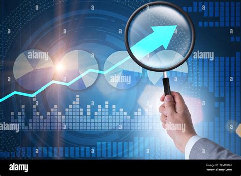 Concept Of The Economic Growth With Chart And Magnifying Glass Stock