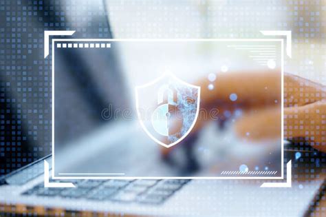 Digital Lock And Shield Icon Overlayed On A Blurred Laptop Background Symbolizing Cybersecurity