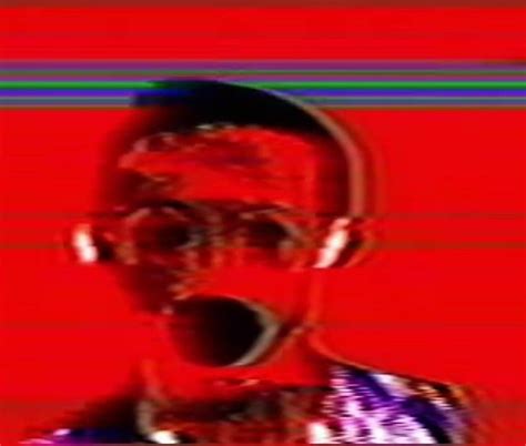 A Man With Headphones On In Front Of A Red And Blue Background That Has Lines