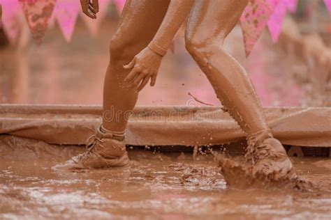 Mud Race Runner Women Crawling In The Mud Under Obstacles Stock Image Image Of Happy Pool
