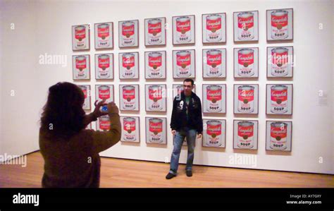 Man Posing To Woman In Front Of Andy Warhol S Campbell S Soup Cans The Museum Of Modern Art Moma