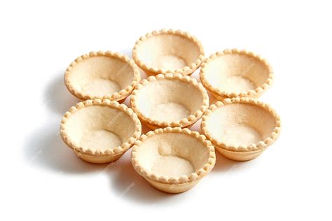 Premium Photo Unfilled Tartlet Shells Isolated On A White Seven Crispy Mini Tart Shells For