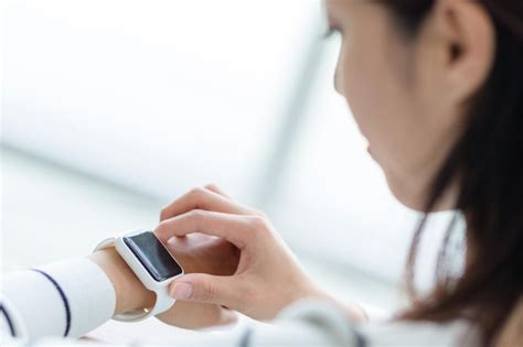 Premium Photo Woman Touch On The Smart Watch