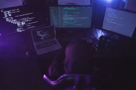 Premium Photo Top View At Unrecognizable Cyber Security Hacker Wearing Hood While Working On