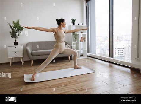 Caucasian Woman Spread Legs Wide Straightening Arms In Different Directions Stock Photo Alamy
