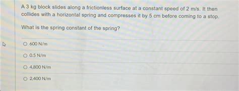 Solved A Kg Block Slides Along A Frictionless Surface At A Chegg