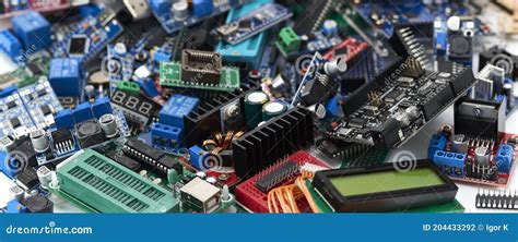 The Electronic Components Of Arduino Microcontrollers And Programmers Are Piled Up Selective