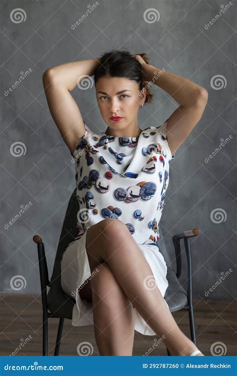 Portrait Of A Brunette With Red Lipstick Holding Her Hair With Her Hands Stock Photo Image Of