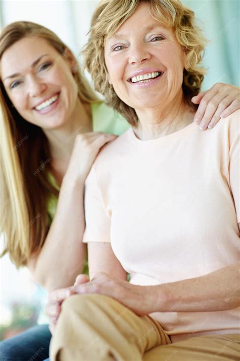Premium Photo Portrait Mature Mother And Daughter On Sofa With