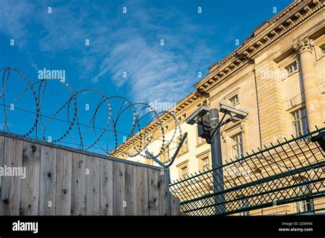 Barbed Wire And Surveillance Camera At The Entrance To An Administration Building Berlin