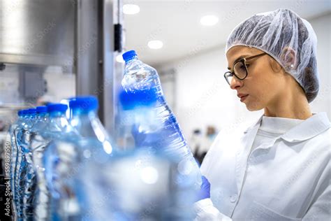 Female Food Factory Worker Checking Water Quality In Bottling Plant Stock Photo Adobe Stock