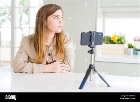 Beautiful Young Woman Doing Online Video Call Using Smartphone Webcam