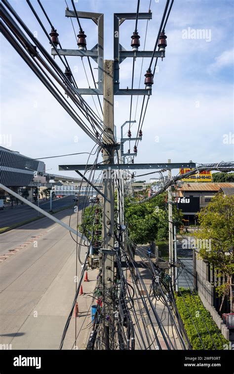 This Photo Provides An Aerial Perspective Of A Street Filled With An Intricate Network Of Wires