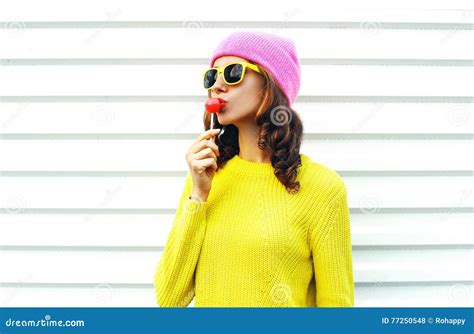 Portrait Fashion Pretty Cool Girl Sucking Lollipop In Colorful Clothes