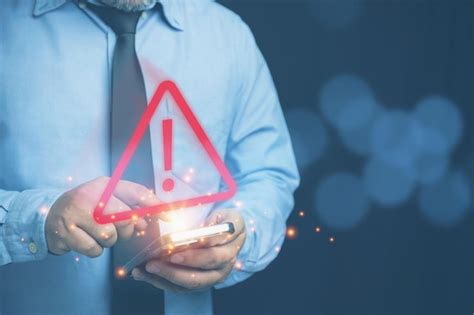 Premium Photo Businessman Use A Smartphone With Red Triangle Caution Warning Sign For Errors